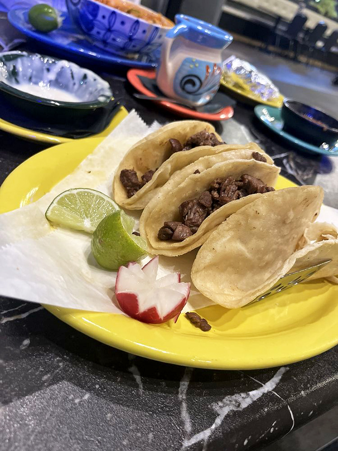 Street tacos displayed with the simplicity they deserve. Meat, cilantro, onion, and a lime wedge &ndash; the fantastic four of taco perfection.