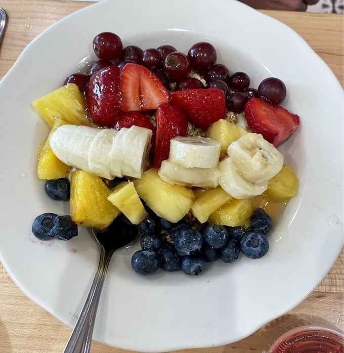 This fruit bowl is the virtuous counterpoint to your biscuit indulgence—the angel on your shoulder saying "balance is key."