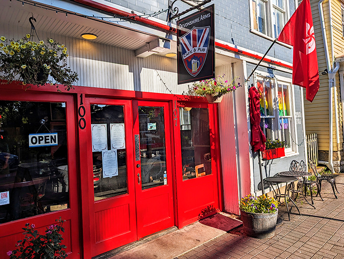 The Devonshire Arms' bright red doors practically shout "Come in!" to passersby seeking British pub comfort in Appalachia.