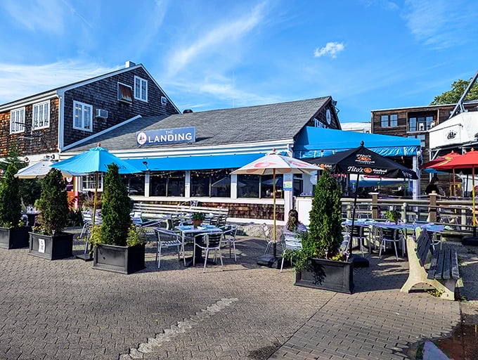 The Landing Restaurant offers harbor-side dining where the seafood travels mere yards from boat to plate. Those blue awnings have sheltered happy diners for decades.