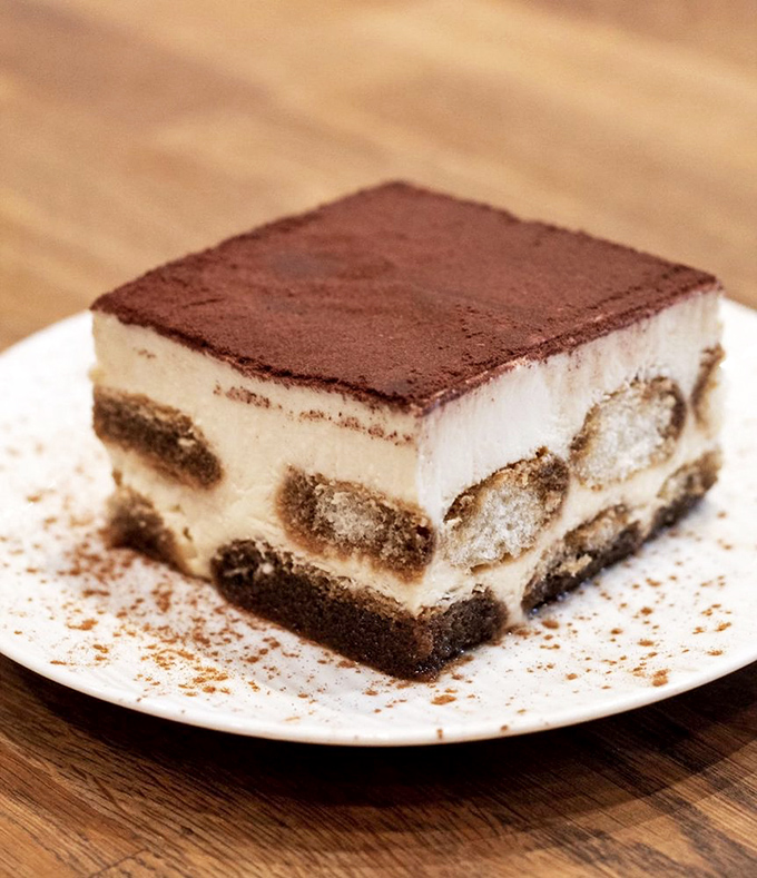 Tiramisu that would make your Italian grandmother weep with joy. The perfect balance of coffee, cream, and cocoa in every bite.