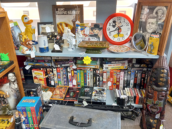 The VHS collection isn't just nostalgic&mdash;it's archaeological. That Mickey Mouse clock stands guard over entertainment history like a cheerful sentinel.
