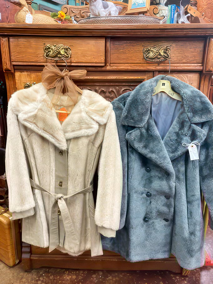 Vintage fur coats hang like sleeping movie stars waiting for their close-up. They've seen cocktail parties and winter weddings that Instagram will never know.