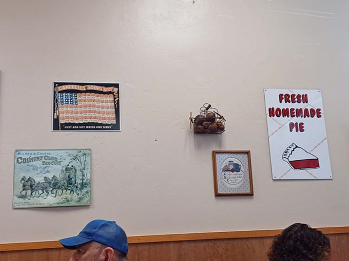 Wall art that tells stories without trying too hard. No curated gallery here&mdash;just decades of personality accumulated like delicious layers in a club sandwich.