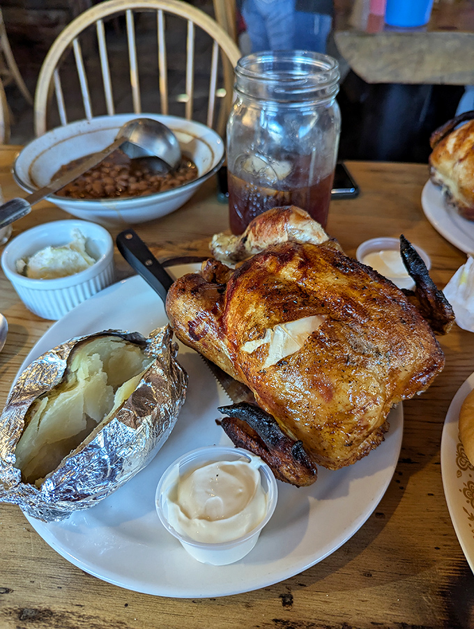 The alternative to beef: a golden-brown whole chicken that would make any farmyard rooster proud, accompanied by that signature potato.