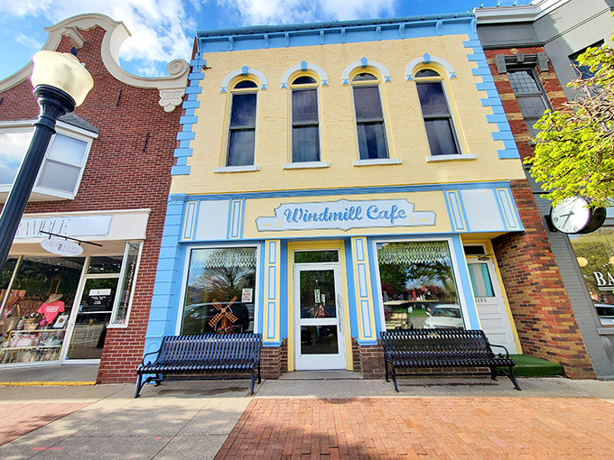 The Windmill Cafe's cheerful blue and yellow facade is like a slice of Dutch optimism served up on Pella's main street.