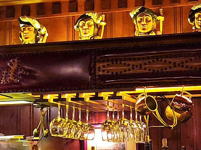 Decorative carved figures watch over the dining room. These silent sentinels have witnessed countless proposals, celebrations, and first dates.