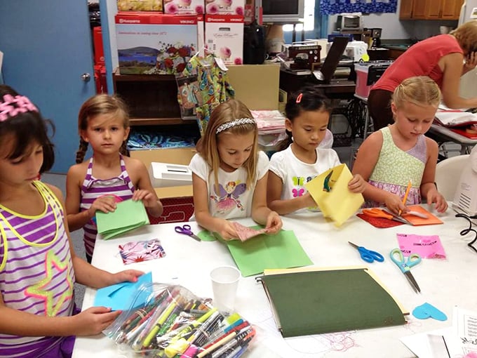 Young crafters learning skills that screens can't teach. Their focused expressions say, "I made this," not "I bought this."