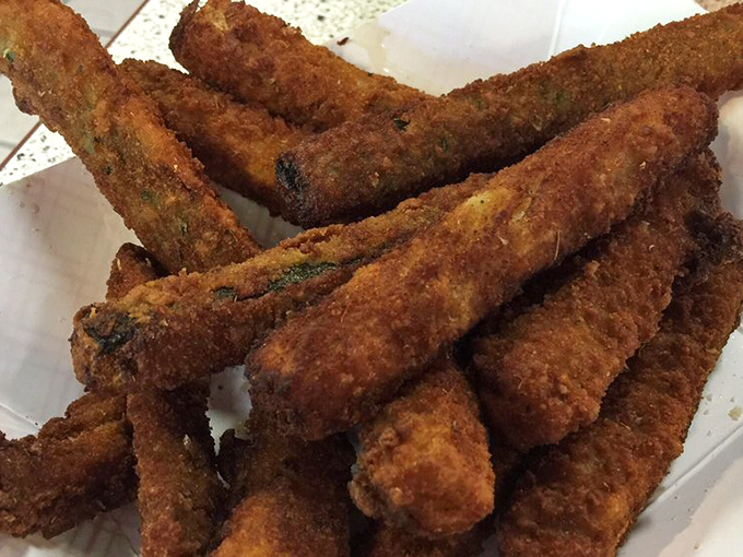 Crispy, golden zucchini sticks that prove vegetables can hang with the big boys at a serious barbecue joint.
