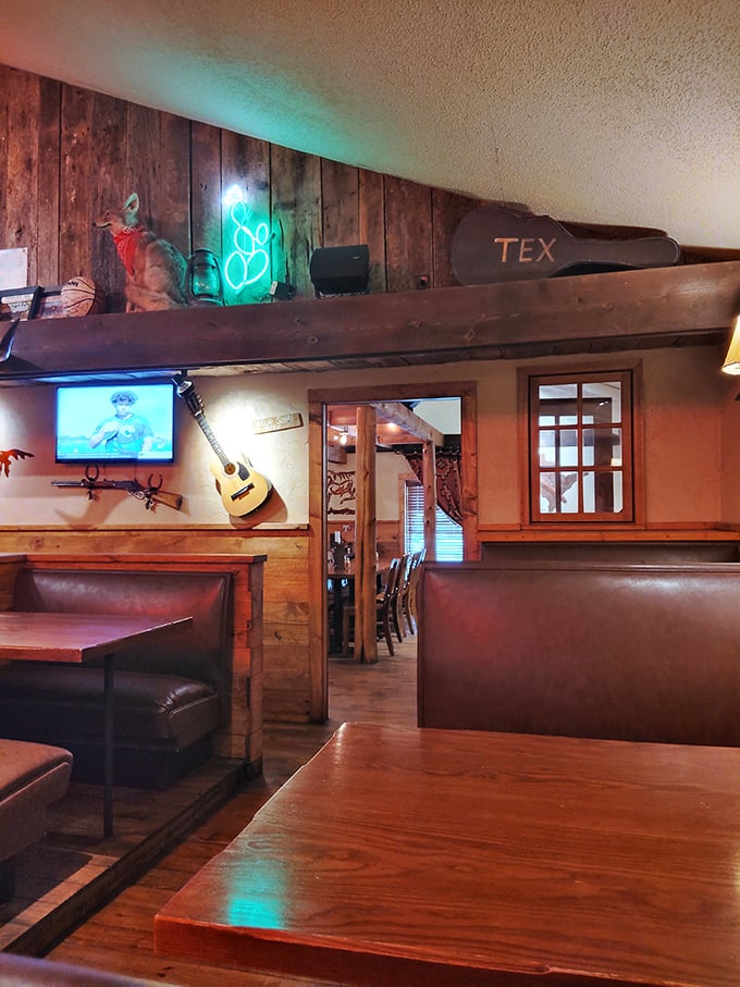 Booths designed for comfort and conversation&mdash;where neon glows softly against wood paneling that's witnessed countless "mmms" of approval.