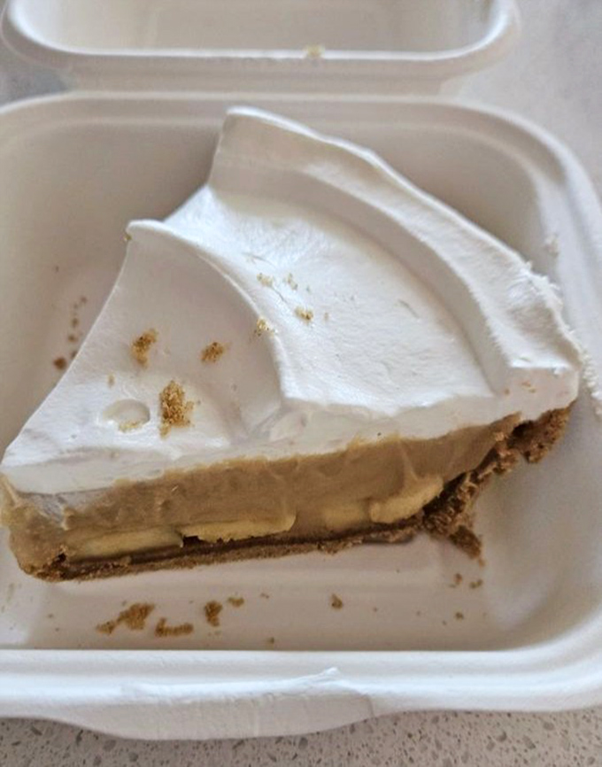 This banana cream pie slice isn't just dessert; it's what would happen if comfort and luxury decided to settle their differences and become best friends.