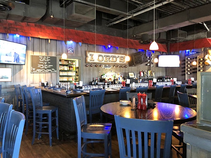 The bar glows with maritime charm, where locals gather to swap fish tales while sipping cocktails that complement the day's ocean harvest.