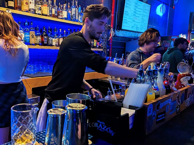 Skilled bartenders craft drinks with the same precision and artistry that went into programming the classic games surrounding them.