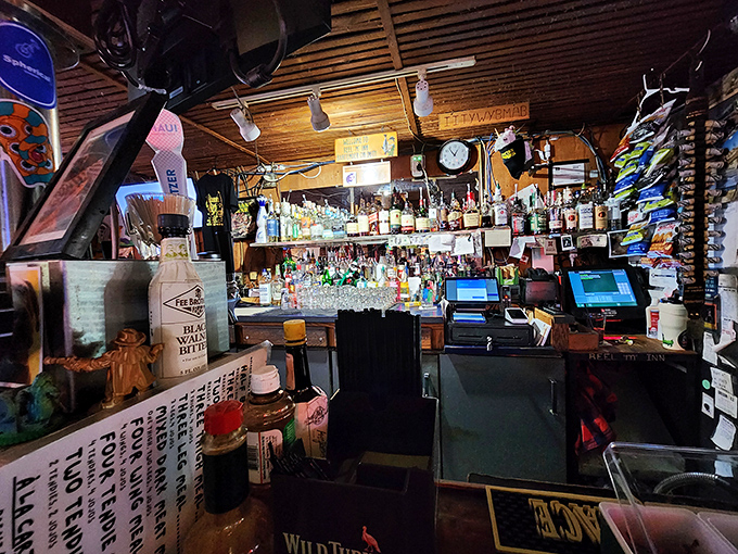 Behind this bar, magic happens with minimal fuss. No mixologists here, just skilled hands pouring honest drinks to wash down honest food.