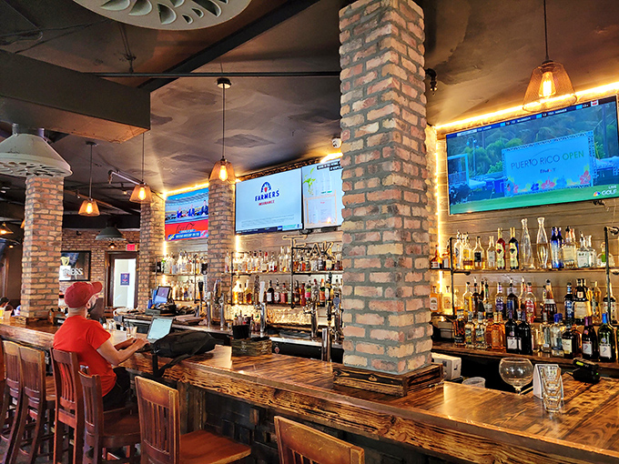 A bar that says "pull up a stool and stay awhile." The brick columns aren't just support beams &ndash; they're witnesses to countless great decisions.