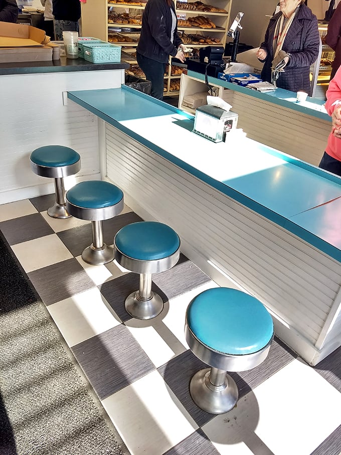 These turquoise counter stools have witnessed countless first dates, family traditions, and the simple pleasure of donut diplomacy.