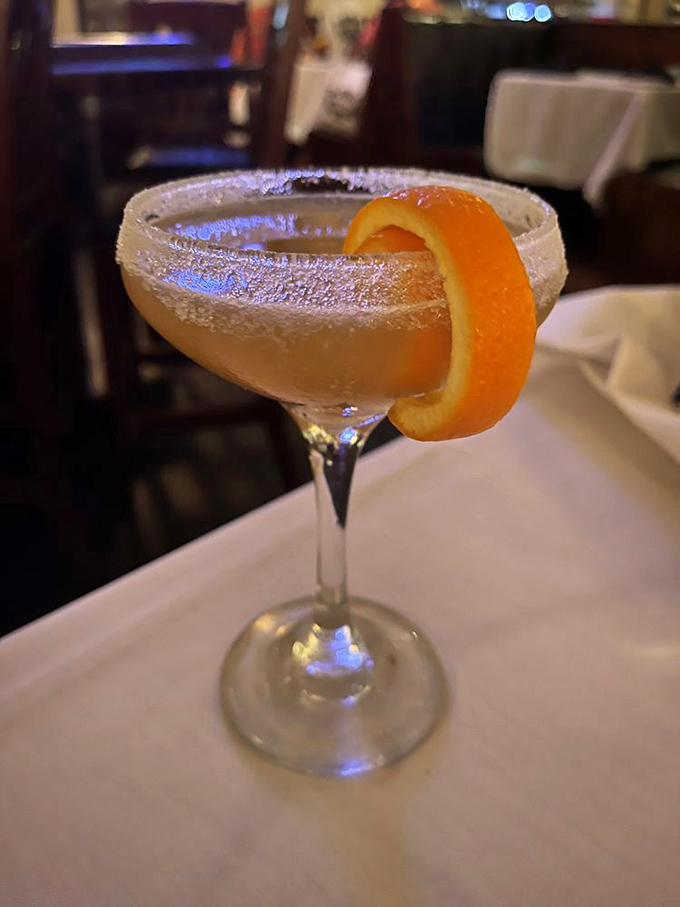 A martini with a perfectly curled orange peel&mdash;James Bond would approve, though he'd be too busy enjoying it to say "shaken, not stirred."