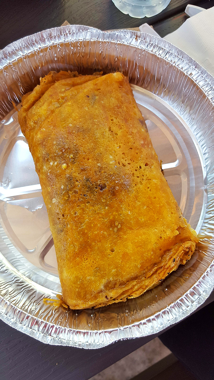 The burrito that launched a thousand road trips, wrapped tight like a present you can't wait to unwrap with your taste buds.