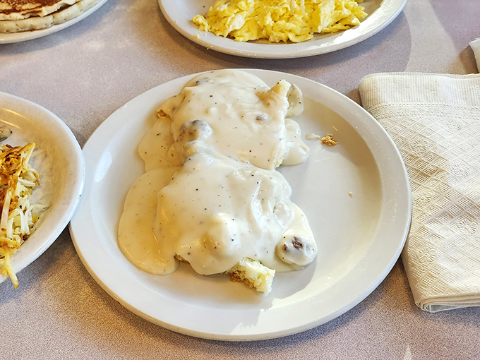 Biscuits and gravy &ndash; the South's greatest contribution to breakfast civilization. This plate doesn't just feed your body, it hugs your soul.