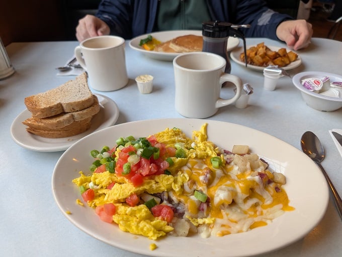 The breakfast plate that launched a thousand satisfied sighs&mdash;eggs, potatoes, and toast in perfect harmony like a culinary barbershop quartet.