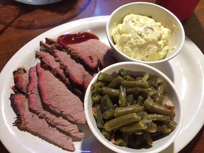 Sliced brisket with that telltale pink smoke ring, potato salad, and green beans&mdash;the Kansas barbecue trifecta that haunts your dreams.