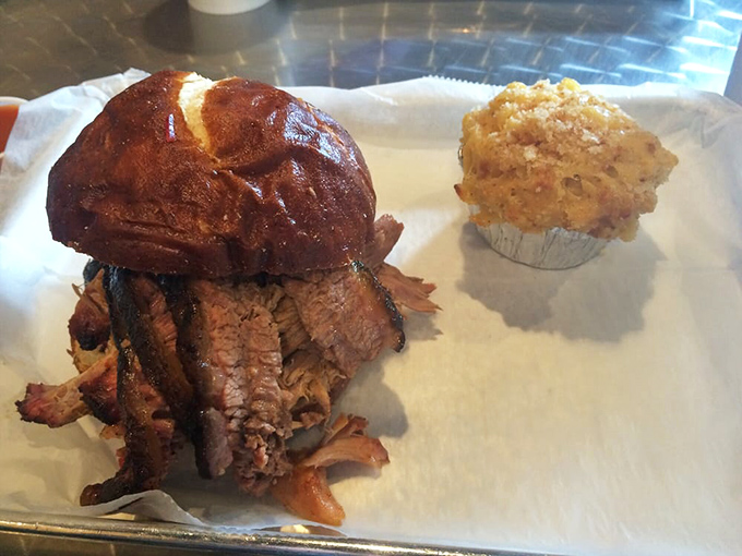That brisket sandwich isn't just lunch&mdash;it's a religious experience nestled in a pretzel bun with a cornbread muffin standing guard.