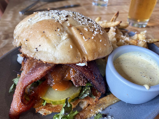 The humble hamburger elevated to art form&mdash;where every layer from bun to bacon tells its own delicious story.