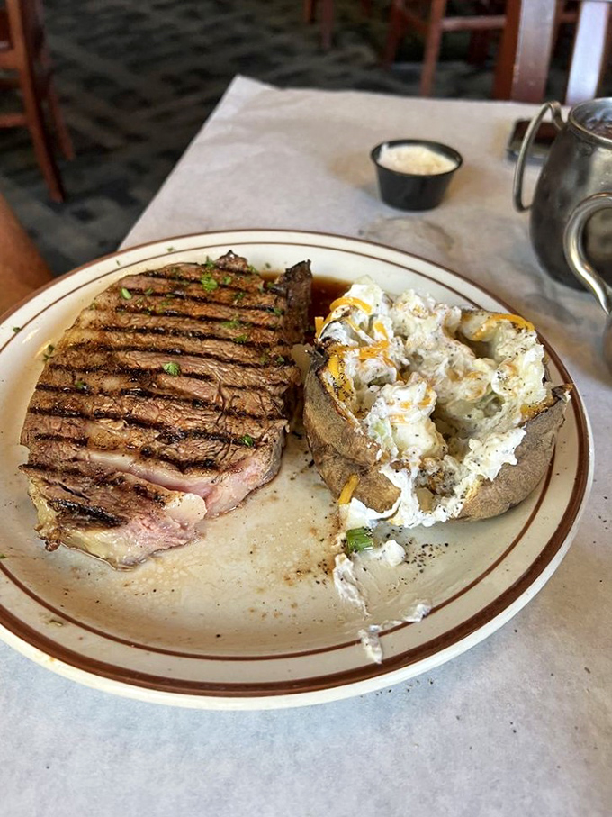 A perfectly grilled steak with those coveted crosshatch marks. This isn't just cooked meat&mdash;it's a testament to timing, temperature, and technique.