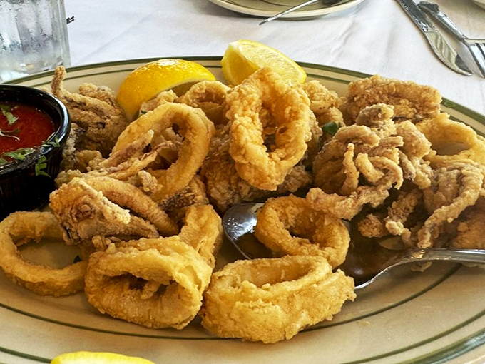 Crispy calamari rings&mdash;the jewelry of the appetizer world&mdash;arranged in a golden pile that disappears faster than your willpower.