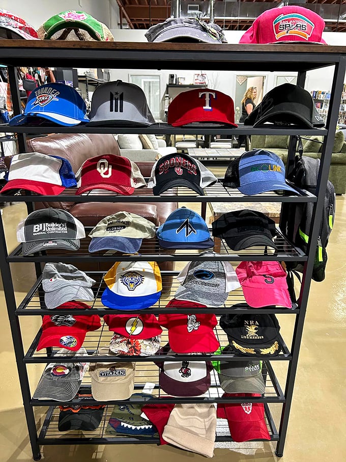 The hat display reads like a sports almanac of Oklahoma loyalties&mdash;Thunder, Sooners, and Cowboys fans united by the universal language of bargain hunting.