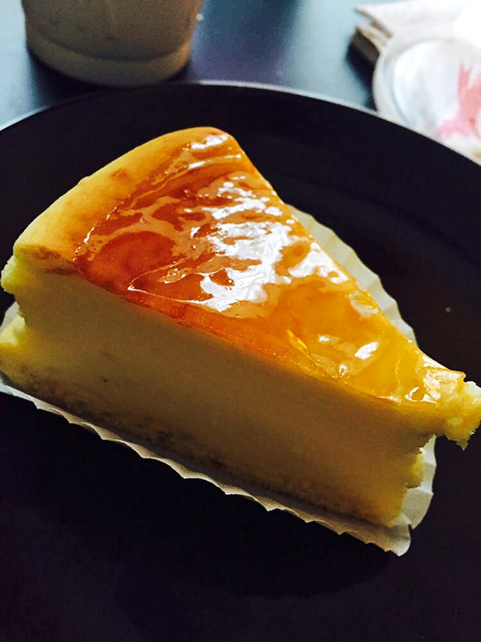 This slice of cheesecake glistens with purpose. That caramelized top isn't just for show&mdash;it's nature's way of saying "eat me immediately."