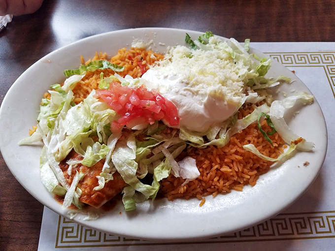 When your plate needs its own zip code&mdash;rice, beans, and enough toppings to qualify as a small garden on your enchilada.