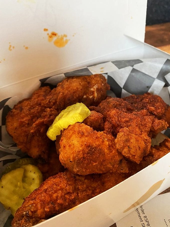 A box of joy containing crispy treasures and pickle coins. This isn't just lunch&mdash;it's edible happiness with a side of endorphins.