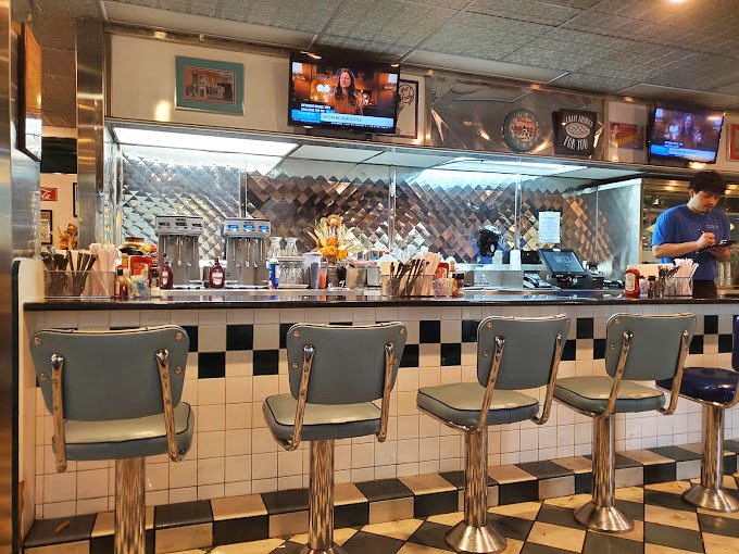 Counter seating: where solo diners become regulars and short-order cooks perform culinary ballet. The heart of any true diner experience happens right here.