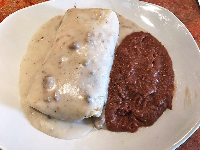 Half burrito, half work of art&mdash;this white-and-red sauce duo creates the culinary equivalent of a sunset over the desert, with potatoes as the mountains.