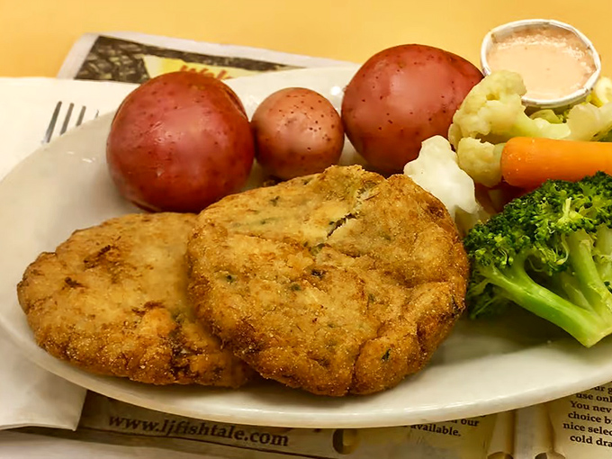 These crab cakes with red potatoes and fresh vegetables prove that sometimes the best plate is one with distinct sections&mdash;like TV dinners for grown-ups with taste.