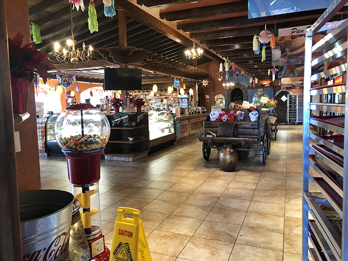 Colorful papel picado banners dance overhead like festive flags signaling the celebration your taste buds are about to experience. No passport required.