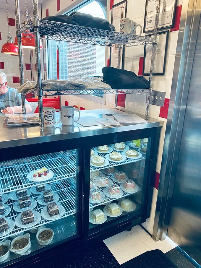 The dessert case—a glass-fronted museum of sweet possibilities where pies and cakes wait patiently for their moment of glory.