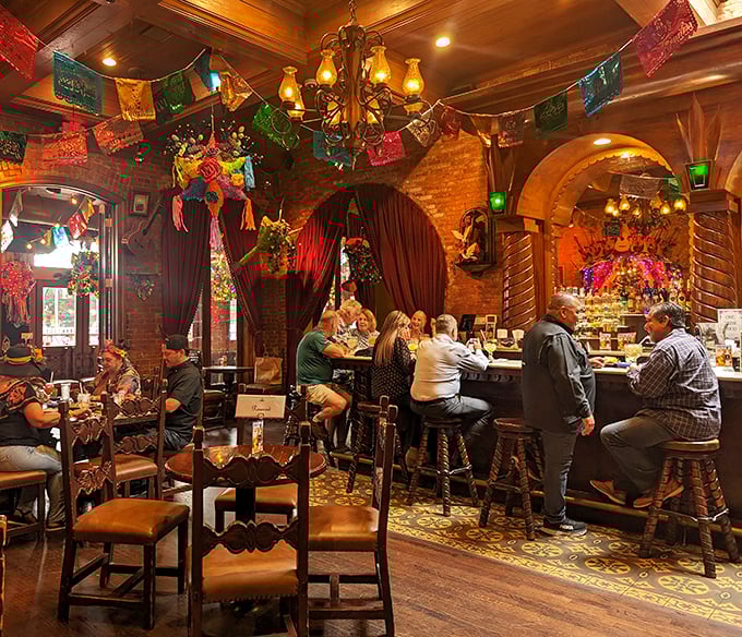 The bar area glows with warm light and festive decorations&mdash;where strangers become amigos over margaritas and shared stories.