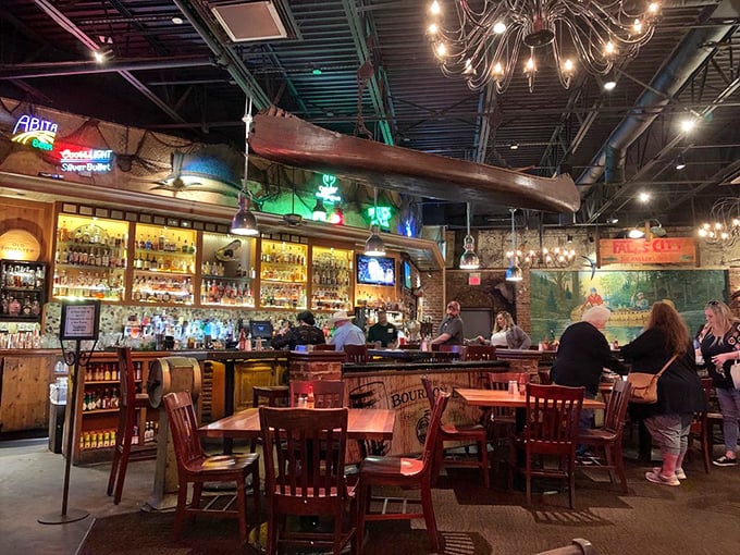 The dimly lit bar area: where bourbon flows, stories grow, and nobody rushes you through your meal or your tall tales.