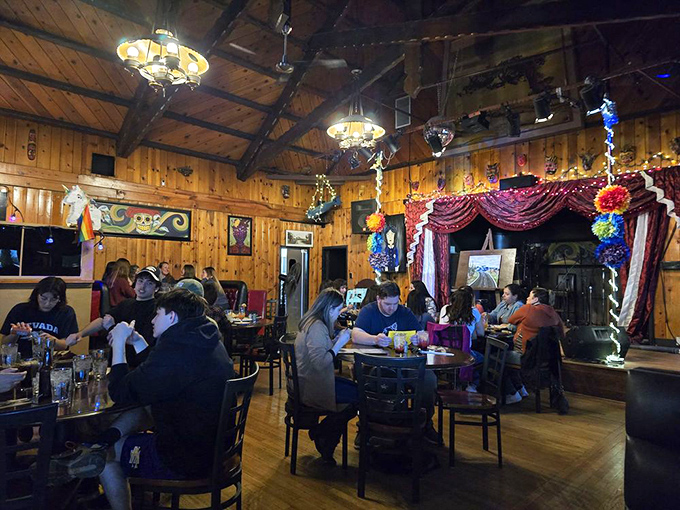 The dining room buzzes with the sound of happy eaters. Notice how nobody's looking at their phones? That's the power of truly great food.
