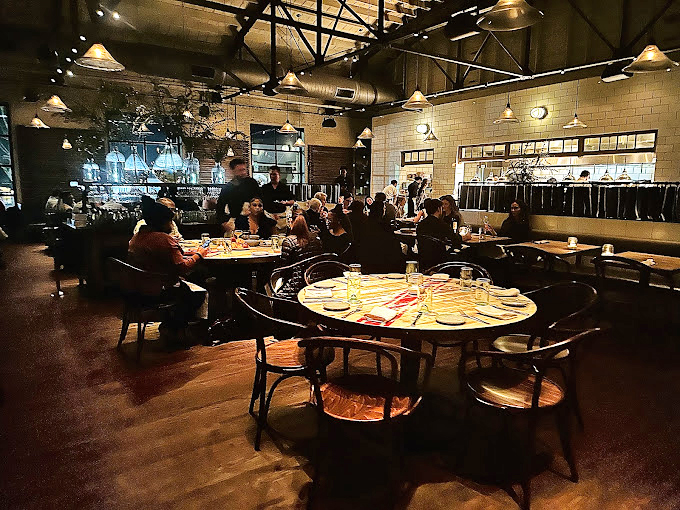 The oyster display&mdash;where briny treasures rest on ice like jewels, awaiting their moment to shine on your palate.