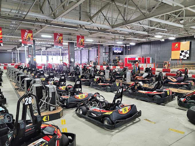A sea of waiting karts, each numbered like racehorses at the Kentucky Derby, ready to fulfill your speed fantasies.