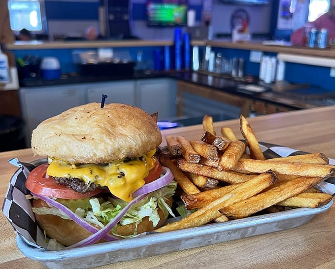 This isn't just a cheeseburger and fries&mdash;it's edible architecture. The melted cheese cascading down the sides is nature's most perfect waterfall.