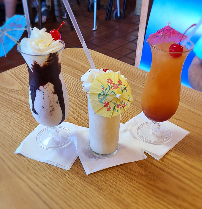 These aren't just drinks—they're vacation in a glass. That little paper umbrella isn't decoration; it's a tiny celebration.