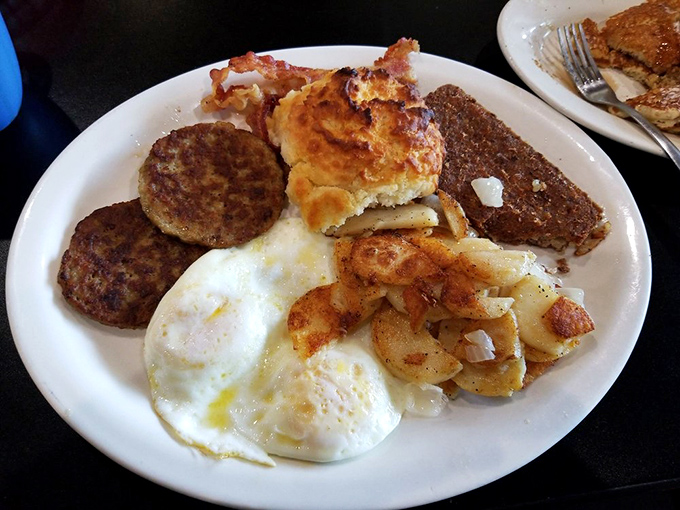 This isn't just breakfast&mdash;it's a diplomatic summit where eggs, sausage, potatoes and toast negotiate perfect harmony on a plate.