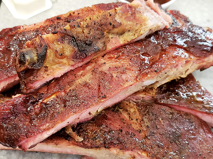These ribs aren't just cooked—they're coaxed to perfection. The meat has that perfect "tug" that BBQ judges dream about.