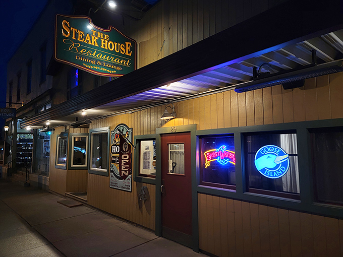 As evening falls, the neon glow beckons hungry travelers like moths to a deliciously flame-grilled flame.