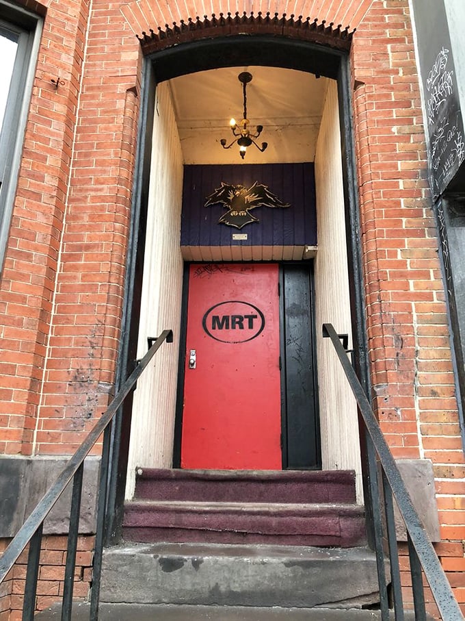 The red door entrance feels like a secret passage&mdash;step through and leave pretension behind for authentic Baltimore character.