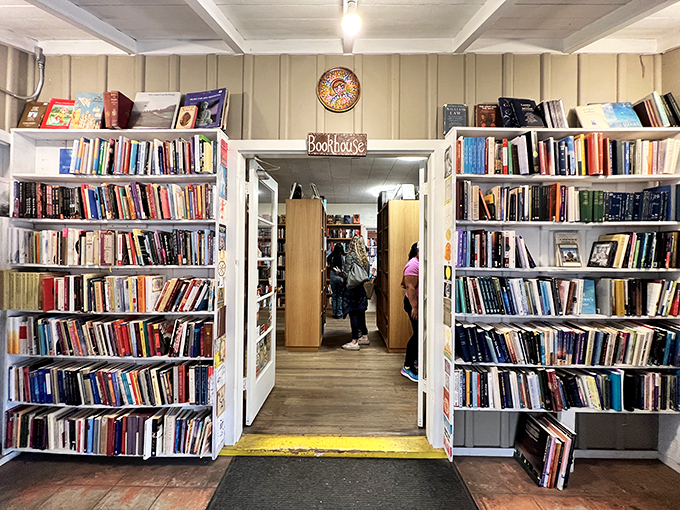 "Welcome to Bookbridge"—the entryway promises literary adventures behind white shelves standing like sentinels guarding countless worlds.